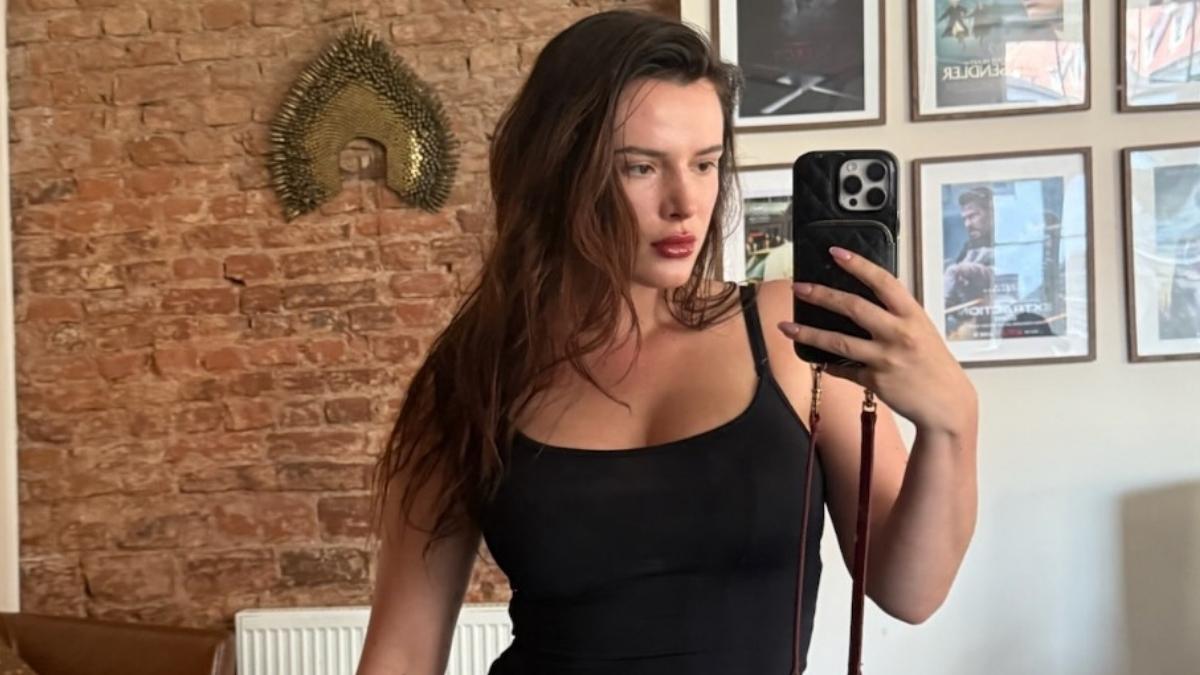 Bella Thorne Lying Down on the Beach in Thongs Will Make You Look Twice ...