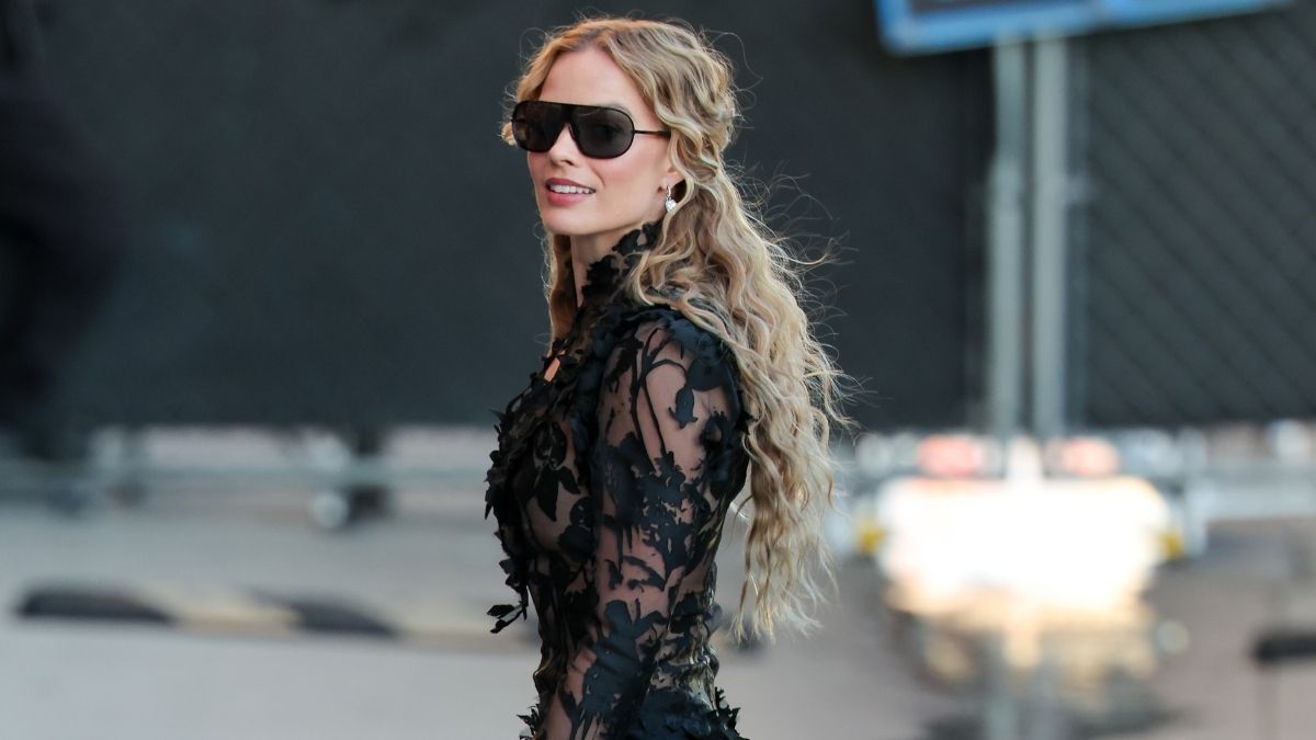 Margot Robbie Poses in Feather Minidress For Press Tour - Mandatory